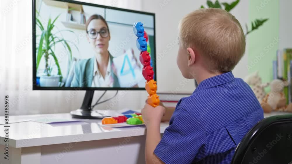 elearning on pandemic isolation, schoolboy with down syndrome shows ...