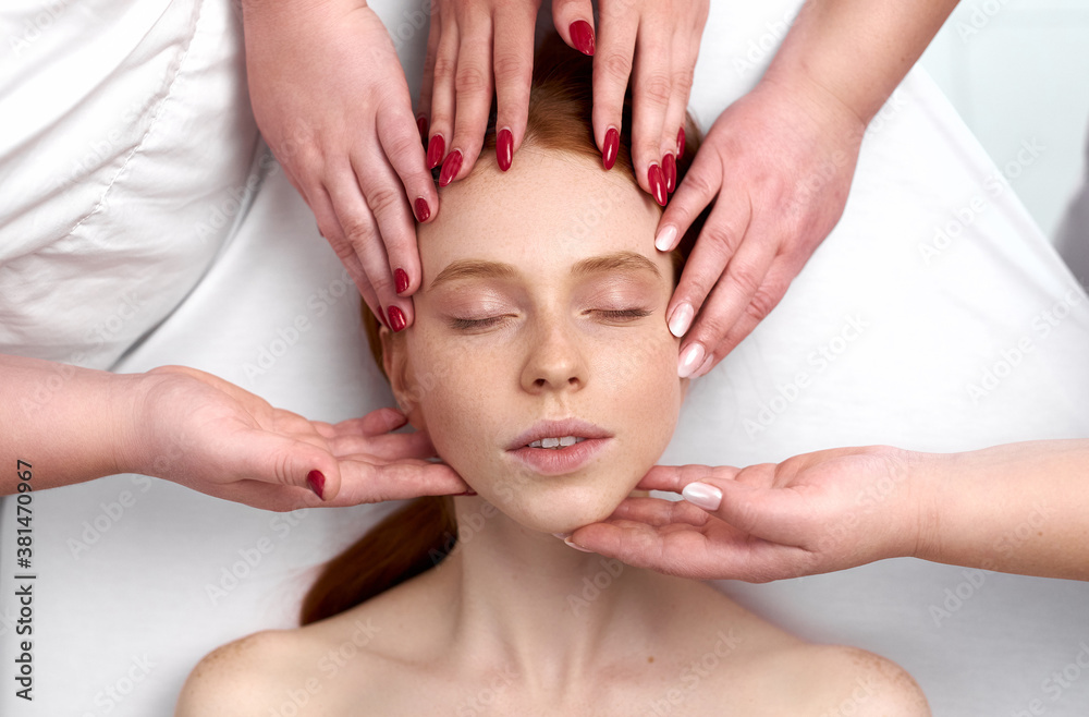 Several Hands Beautician Checks Female Facial Skin Before Aesthetic