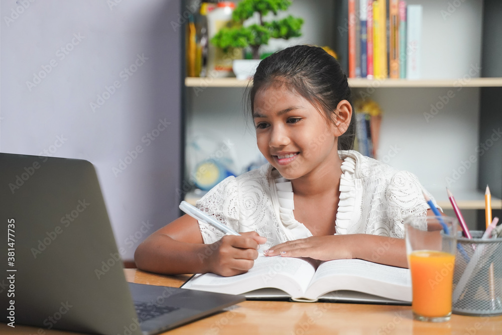 Happy Asian girl student online learning with laptop at home. class ...