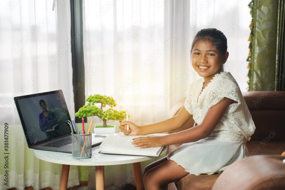 Happy Asian girl student online learning with laptop at home. class ...