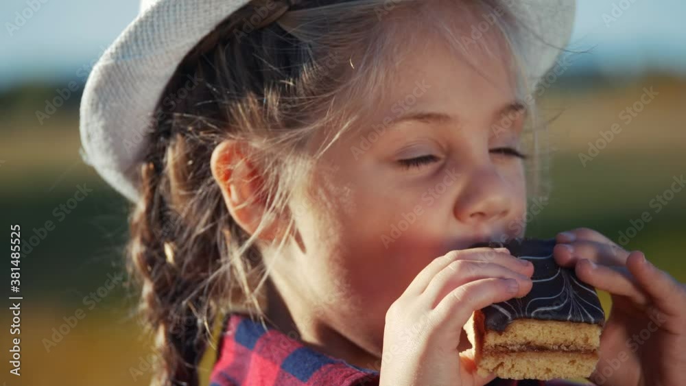 little baby girl eating cake close-up face. happy family child kid ...