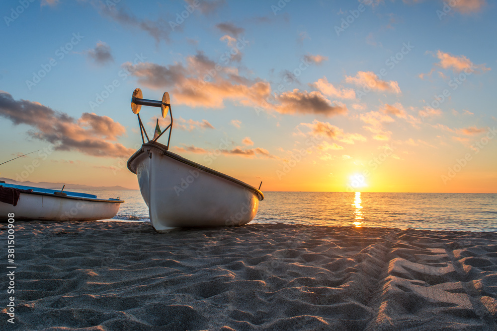 A working fishing boat on the beach At sunset time at jijel Algeria In ...