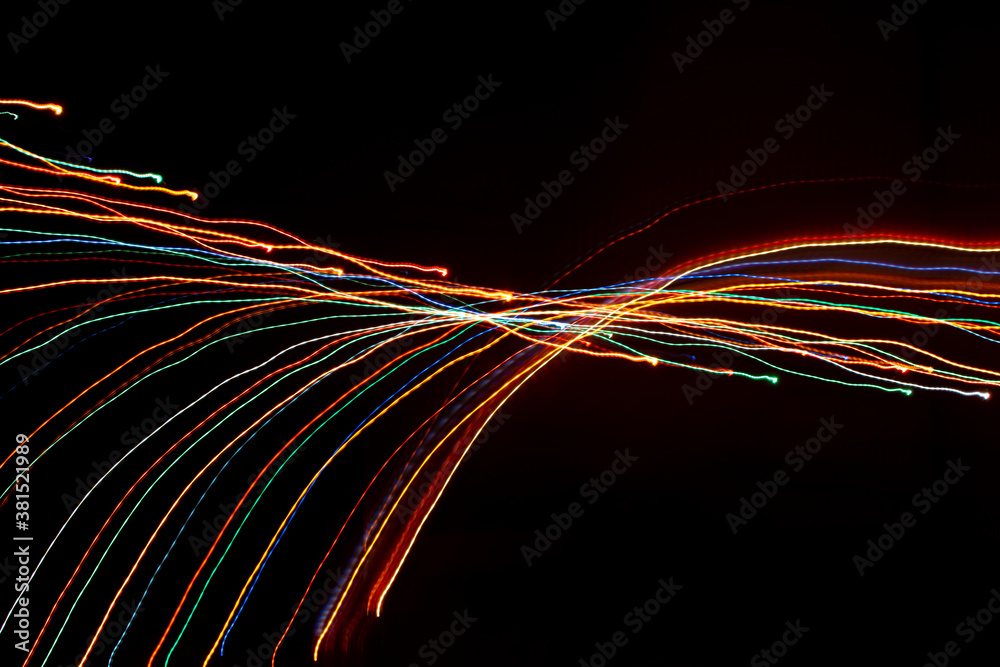 Light painting colored lights with black background scream format with ...