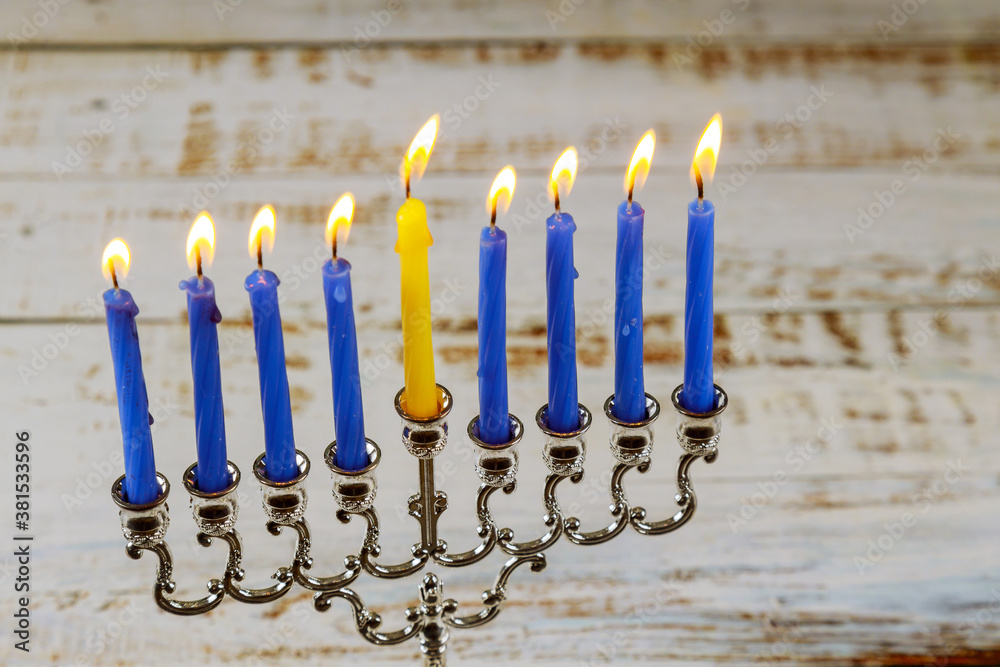 Hebrew Menorah of Hanukkah with burning candles is traditional symbol ...