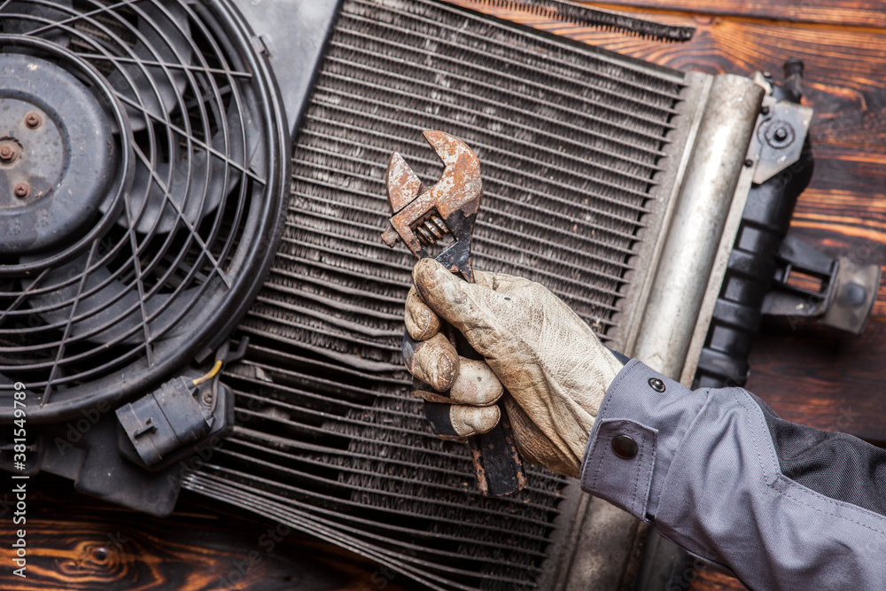 Concept of leaking car radiator replacement by car mechanic Stock Photo ...