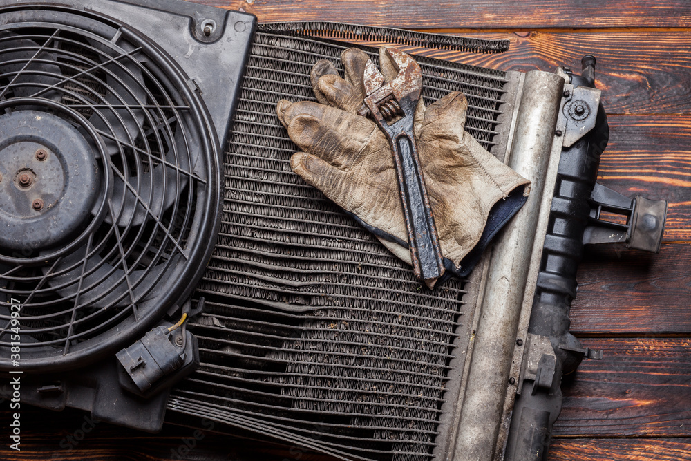 Replacing a leaky and damaged radiator, lunch break. Stock Photo ...