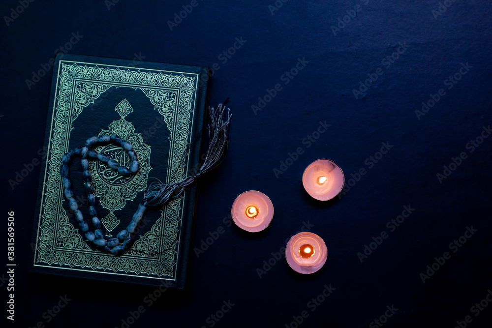 Quran in the mosque - open for prayers The black background of the ...