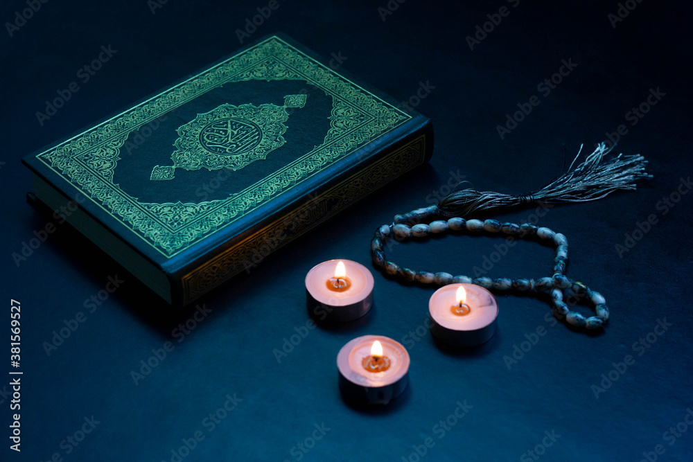 Quran in the mosque - open for prayers The black background of the ...