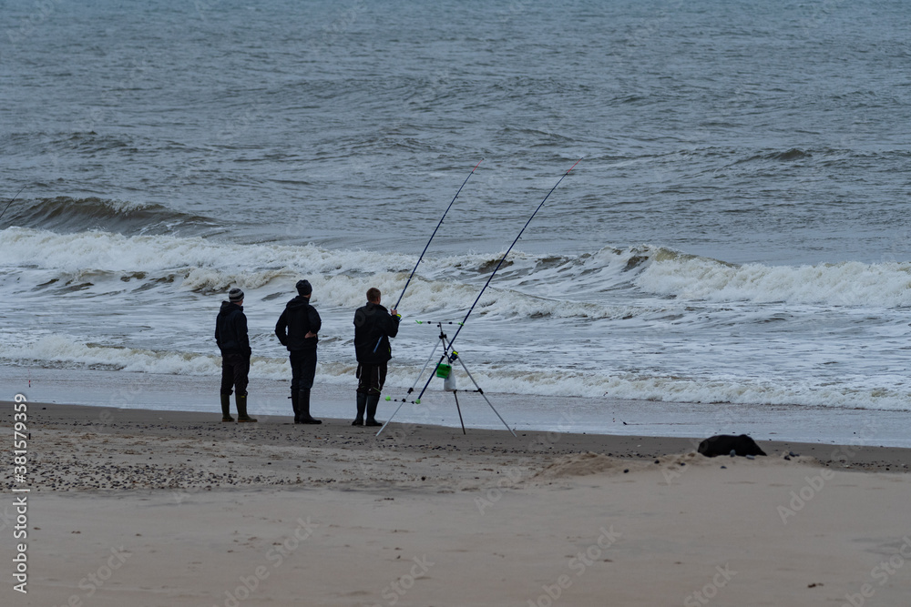 Shore fishing on the beach - Surf fishing is best Stock Photo | Adobe Stock