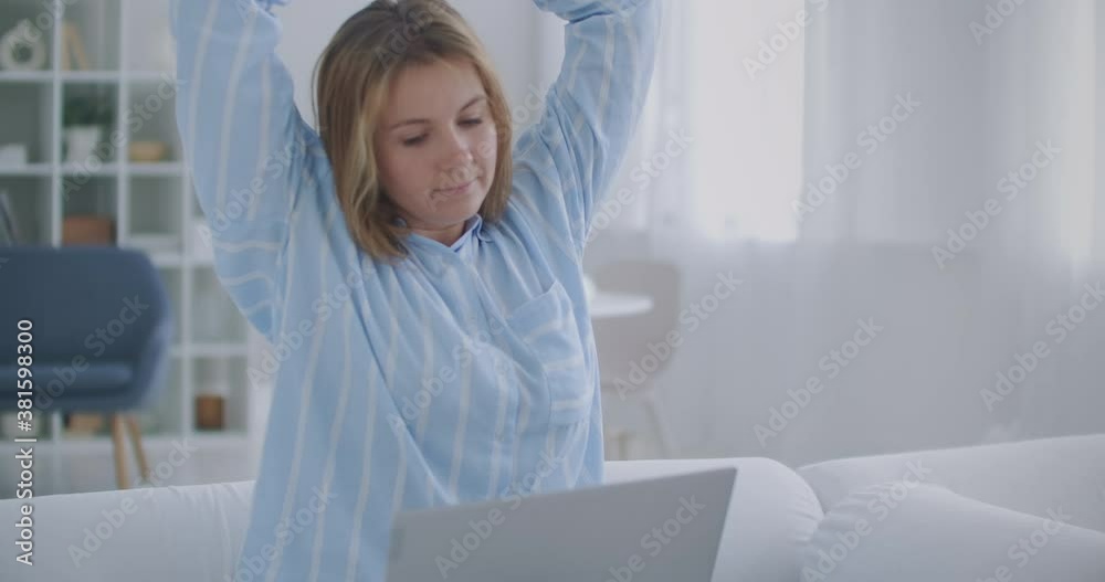 Young woman worker relax sit at office desk finished laptop computer ...