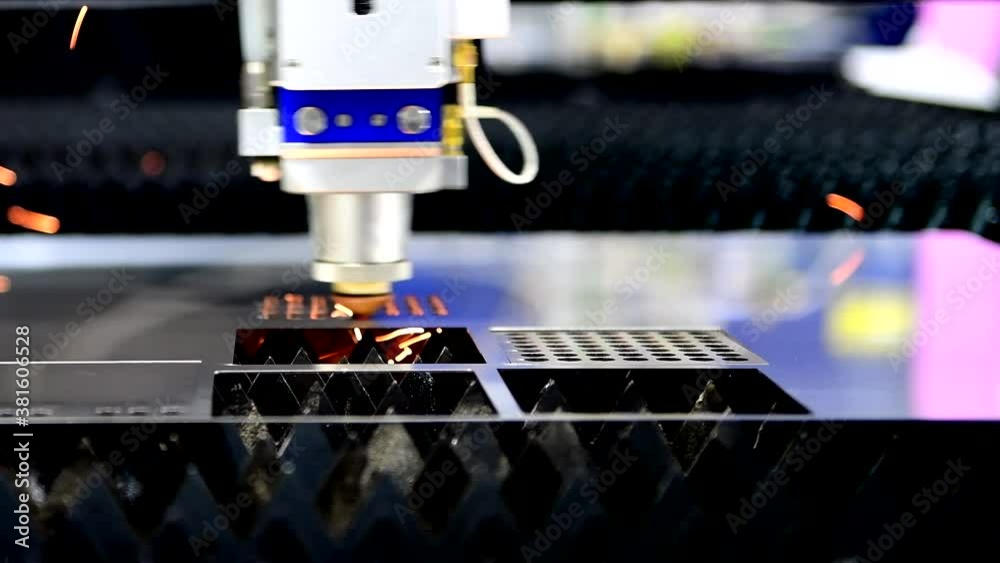 Raytools laser cut head machine while cutting the sheet metal with the ...