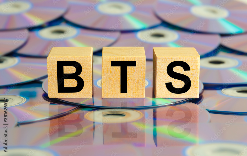 South Korean boy band BTS concept with wooden cubes. BTS word on CD ...