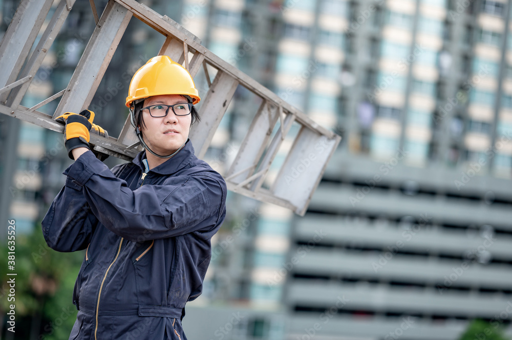 Asian maintenance worker man with protective suit and safety helmet ...