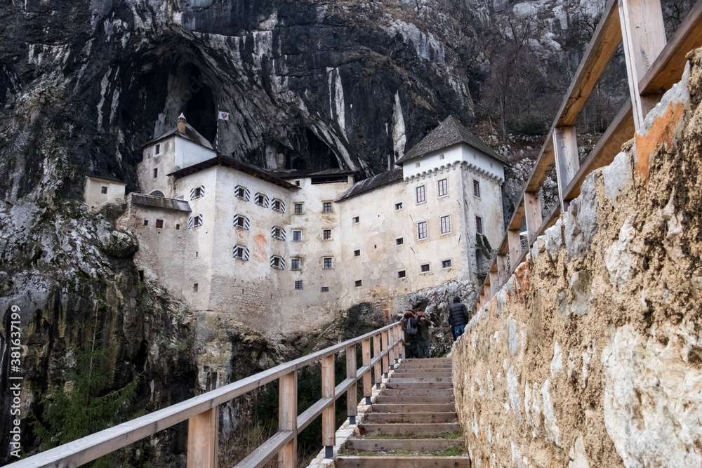 Predjama Castle, situated in the middle of a cliff near Postojna Cave ...