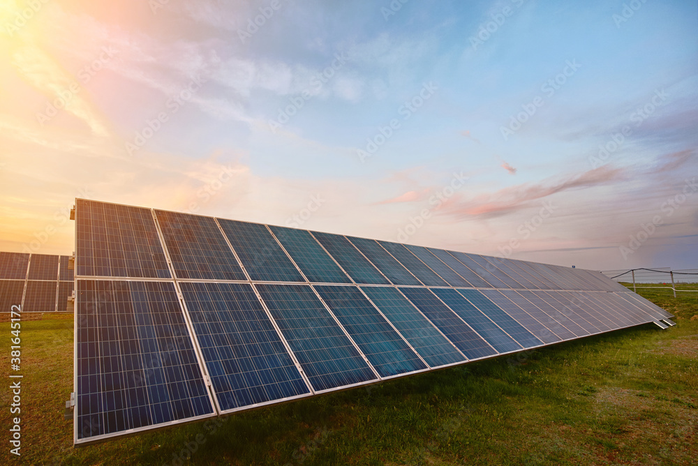 Solar power station, solar panel on sunset background. Photovoltaic ...