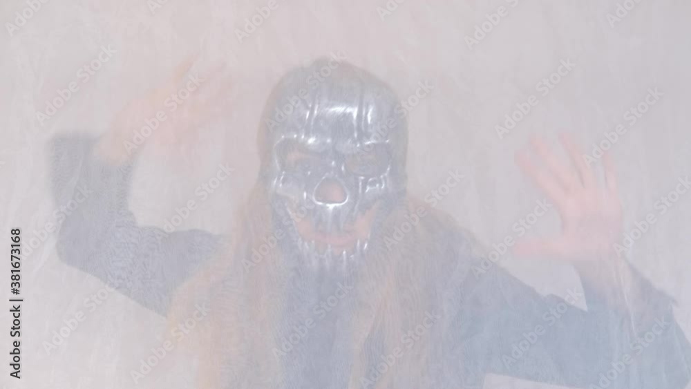 Halloween party. Unknown man in a costume and a skeleton mask ...