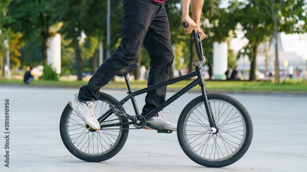 BMX in Moscow park VDNkH. Brave young biker doing stunt. He doing trick ...