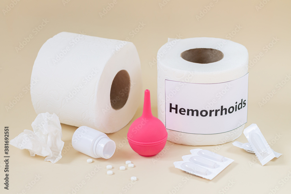 Hemorrhoids and constipation treatment concept. Toilet paper rolls ...