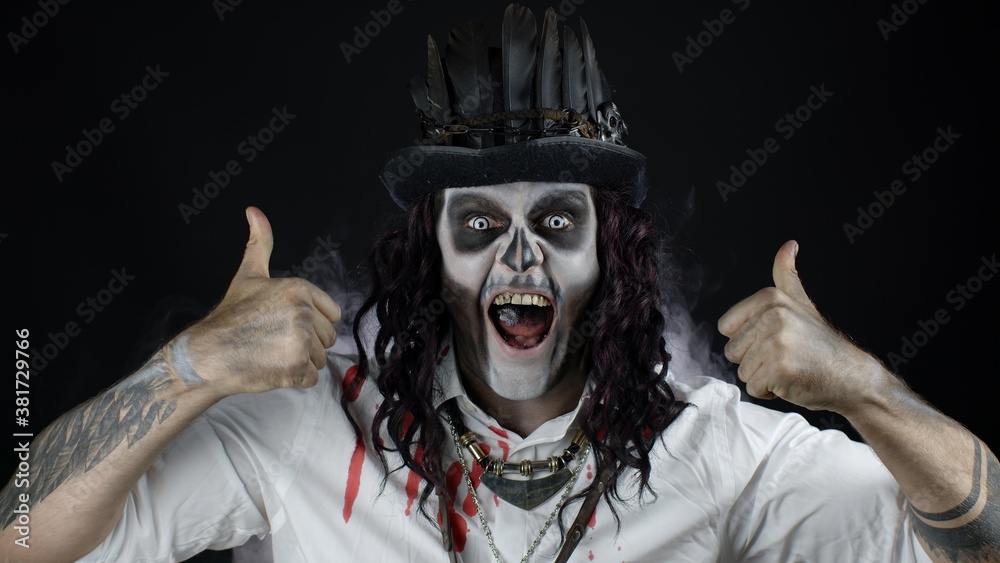 Frightening smiling man in skeleton Halloween costume showing thumbs up ...