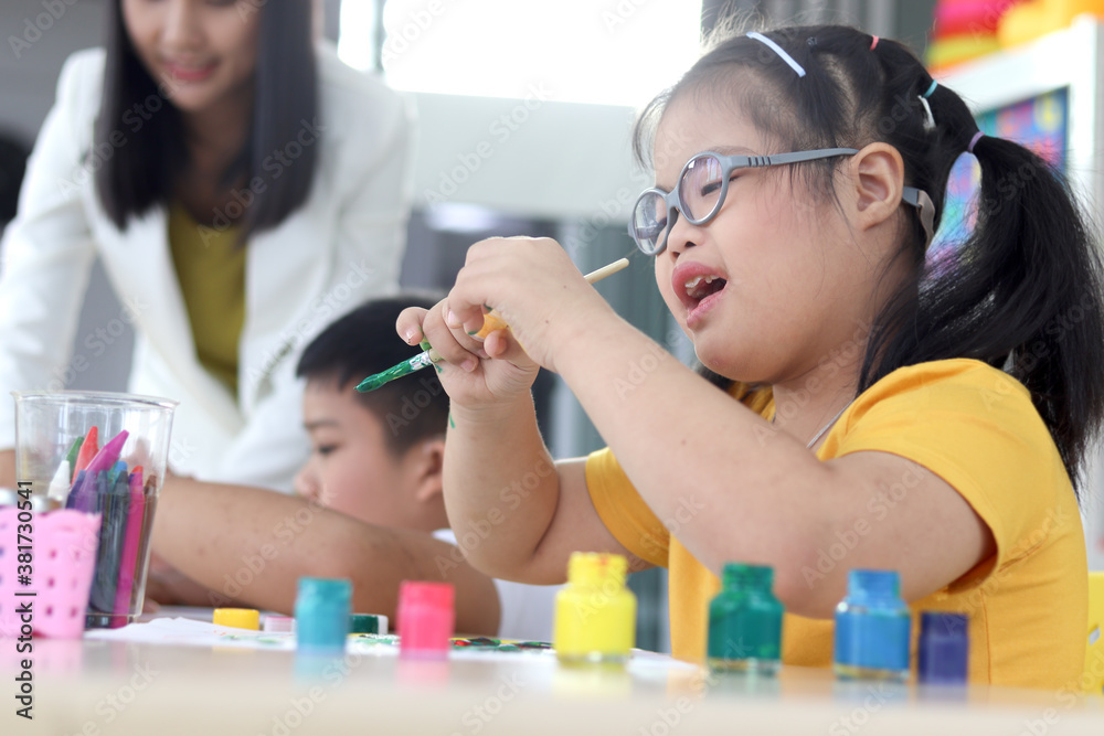 Disabled kids classroom, children having fun during study at school ...
