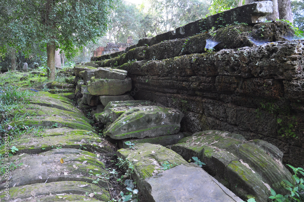 Stone rubble and ruins at the ancient Khmer temples of Angkor Wat, in ...