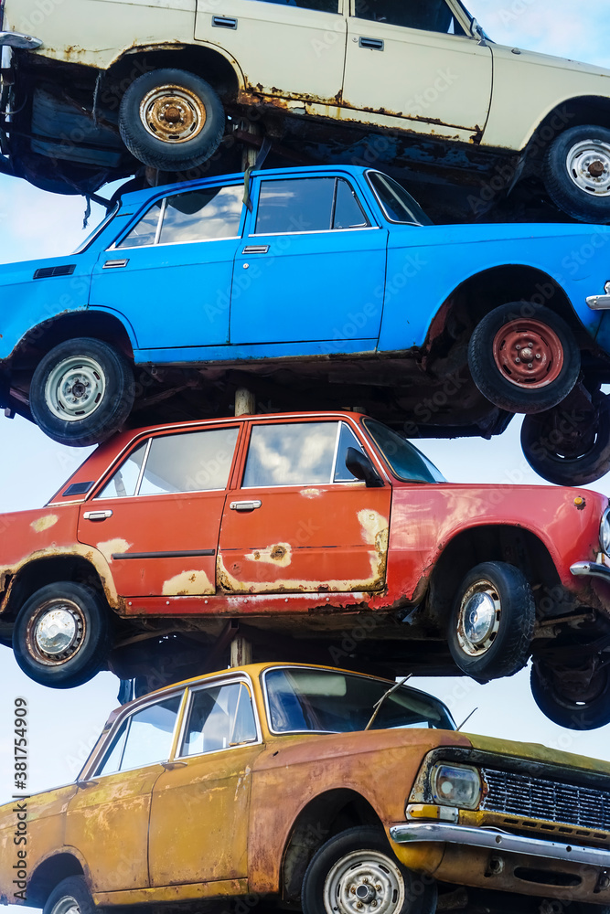 Stack of damaged rusted car scraps on junkyard.Dump broken and crashed ...