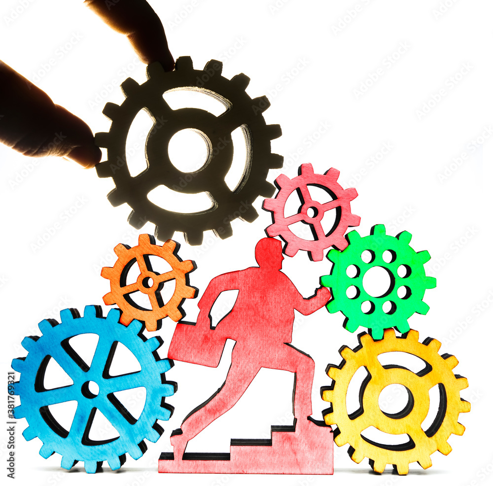 businessman with case running inside many big and small gear wheel ...