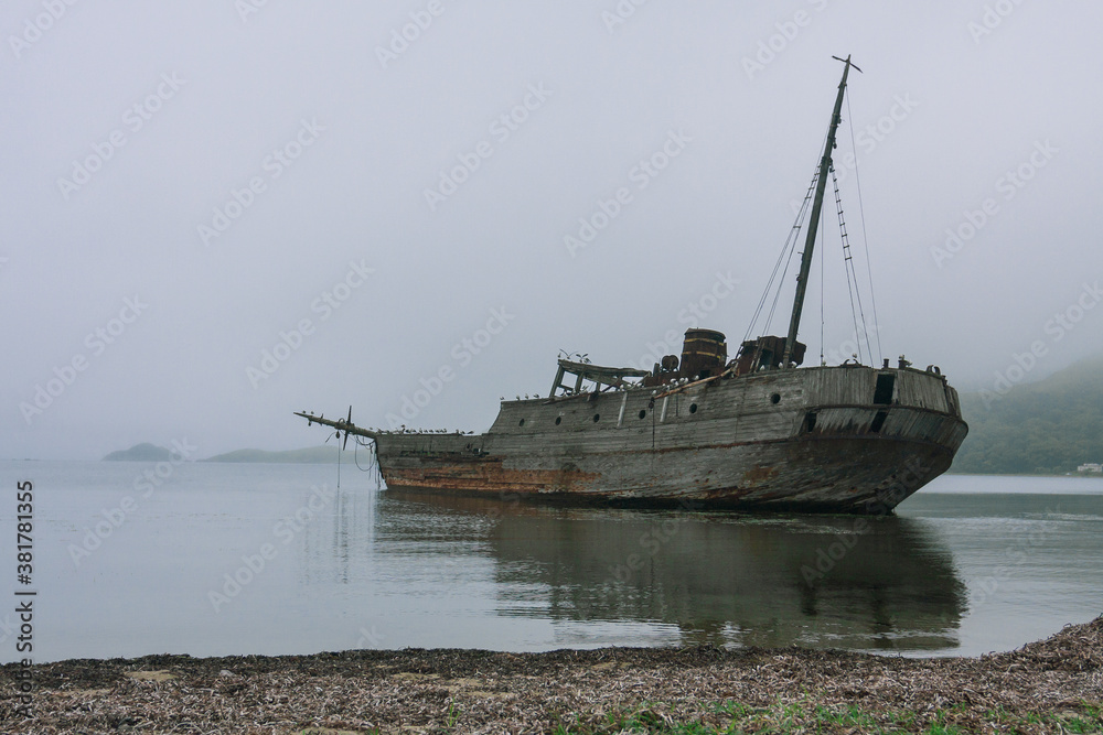 An old wooden Soviet whaling boat, the ship ran aground on the Bay ...