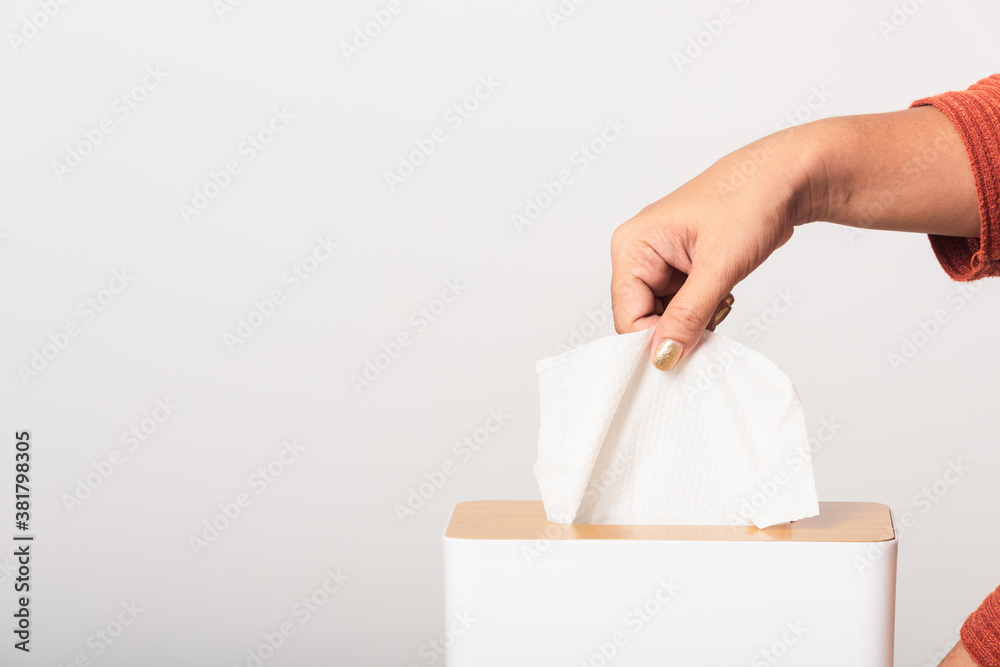 Young woman flu she using hand taking pulling white facial tissue out ...