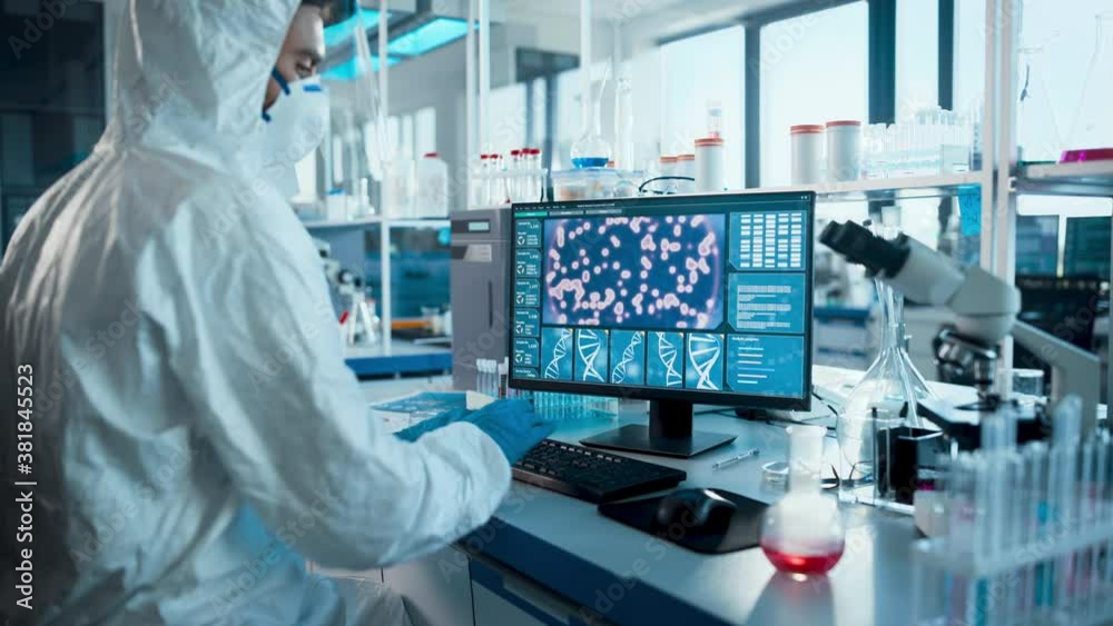 Medical Laboratory: Microbiology Scientist Wearing Sterile Coverall ...