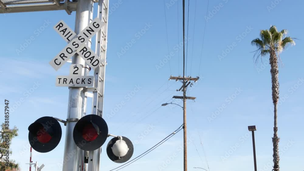 Level crossing warning signal in USA. Crossbuck notice and red traffic ...