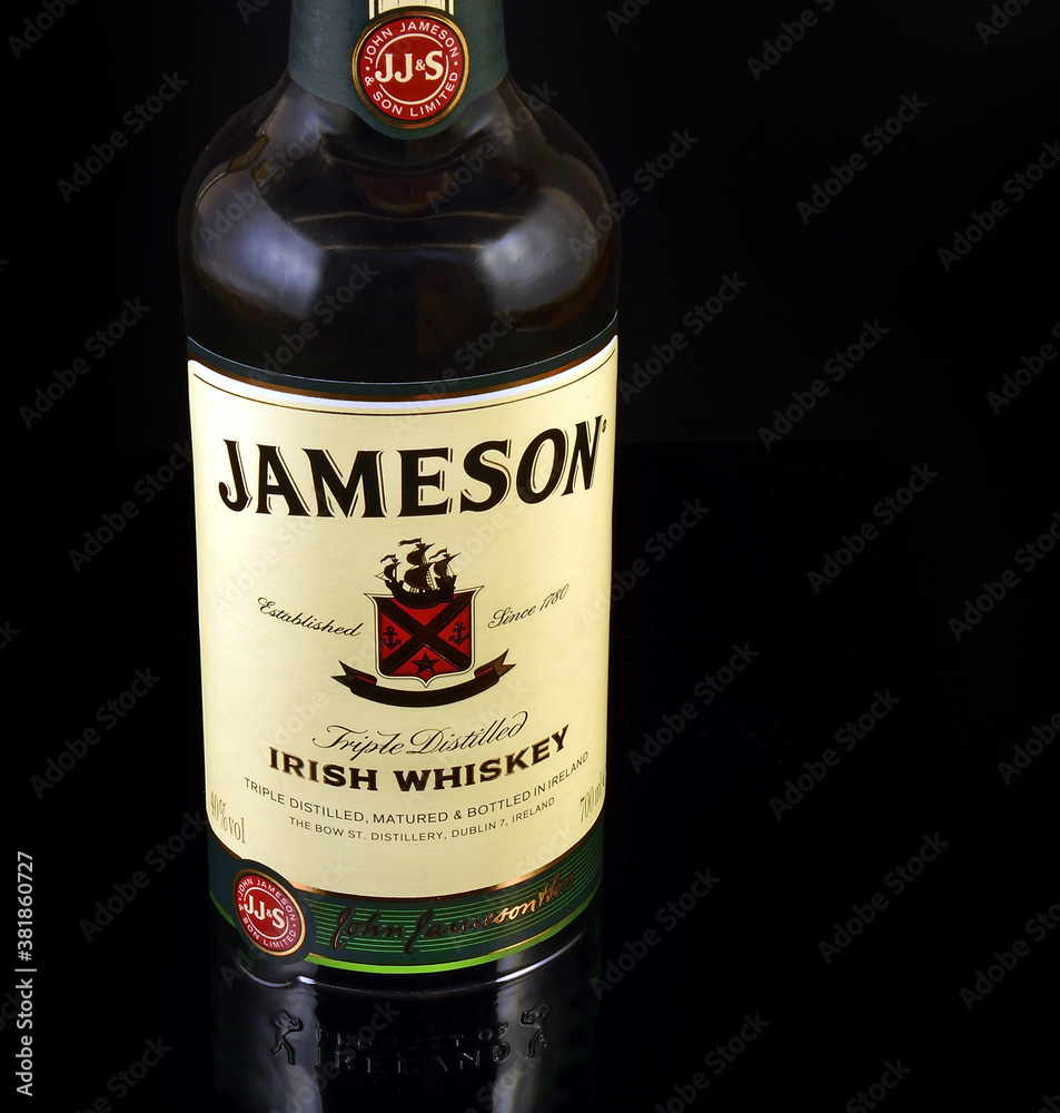 Jameson whiskey, Irish whiskey on black background. Three times ...