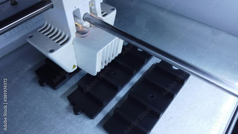 3D printer working. 3D printer, printing with plastic wire filament in ...
