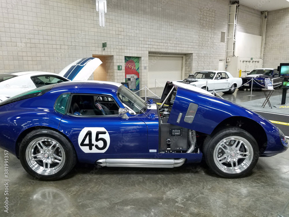 Blue Racing car with number 45 on side and hood open on display Stock ...