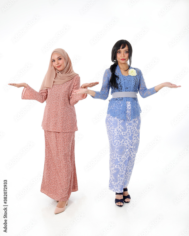Two South east Asian Malay race ethnic origin woman wearing dress ...