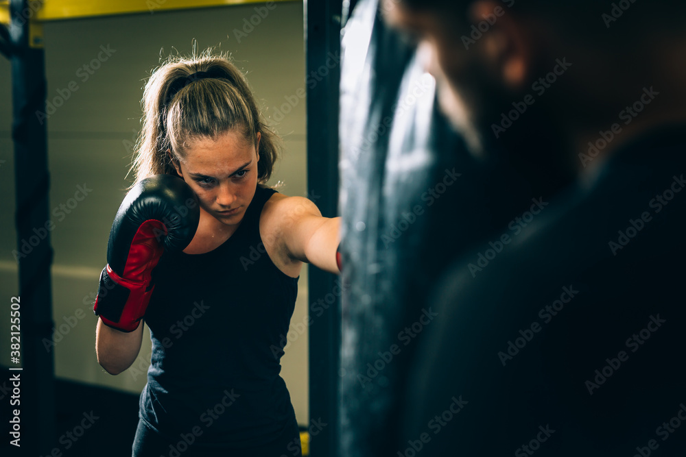 woman practice boxing with her personal trainer Stock Photo | Adobe Stock