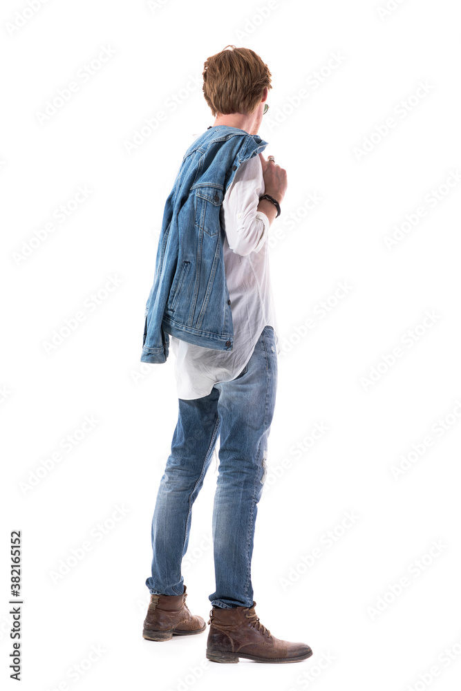 Side view of red hair man in jeans turning head looking down. Full body ...