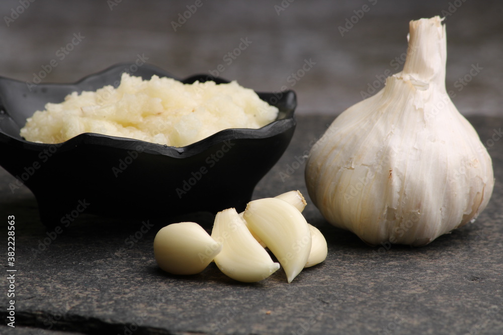 Garlic Paste or Toum or Toumya with raw garlic, isolated over black ...