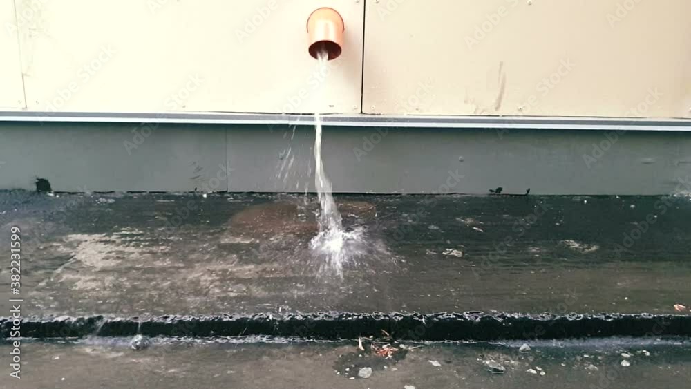 Waste water discharge system in a modern building. Downpipe from which ...