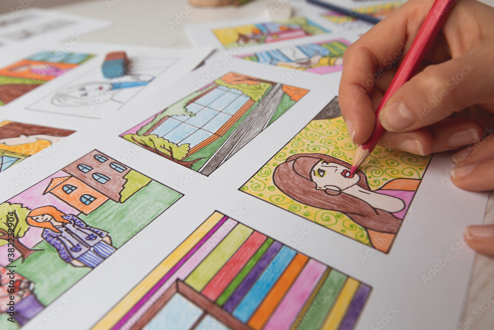 An animator painter draws a color storyboard for a comic book or movie ...