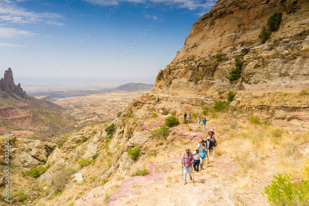 Ethiopian guides with tourists hiking to Gheralta Mountains, Tigray ...