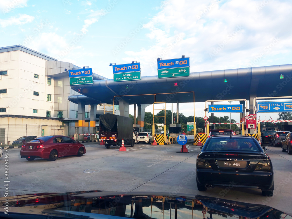 SEREMBAN, MALAYSIA -AUGUST, 2020: Vehicles entering highway toll canopy ...