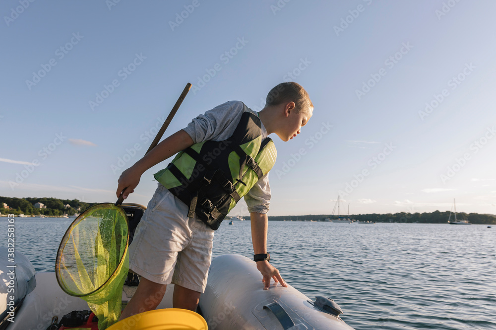 Young Boy with Fishing Net Stock Photo | Adobe Stock