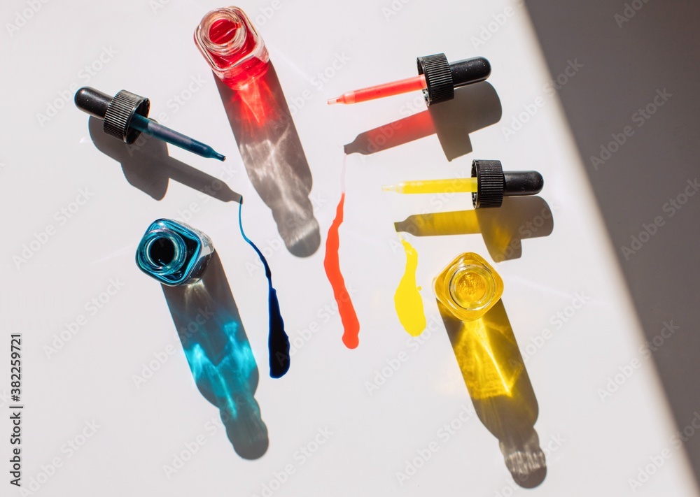 Bottles and pipettes with colorful liquids Stock Photo | Adobe Stock