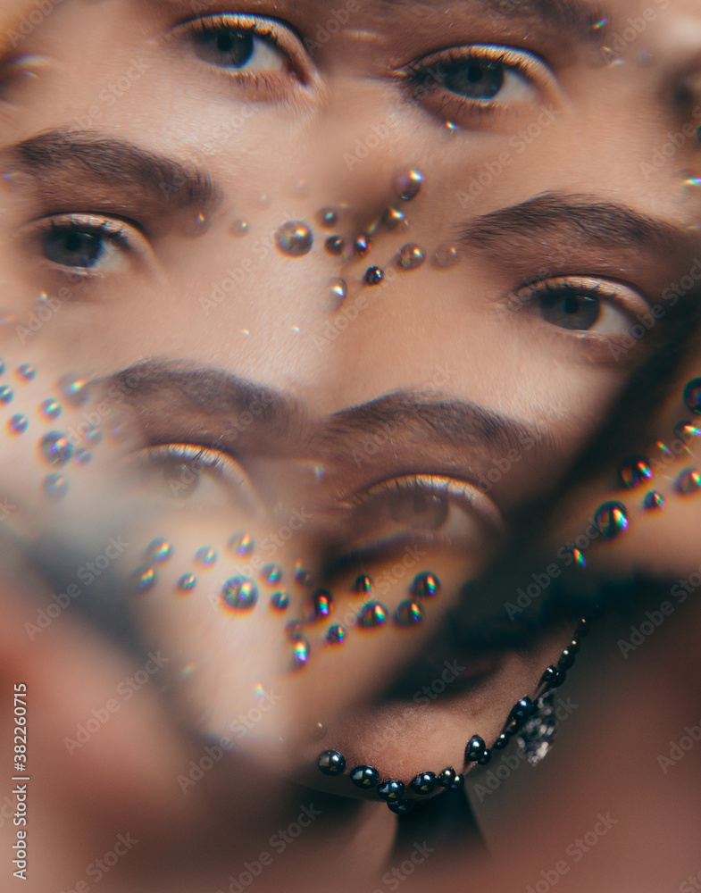 Unrecognizable model with shiny crystals around eyes Stock Photo ...