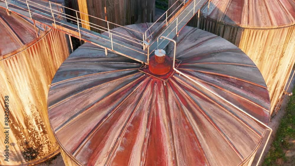 Tower silos in an industrial plant - rusty and stained. Aerial view of ...