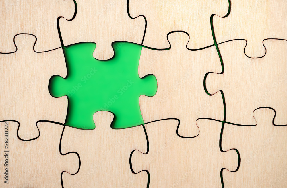 Missing puzzle piece. Almost finished, large jigsaw puzzle made of wood ...