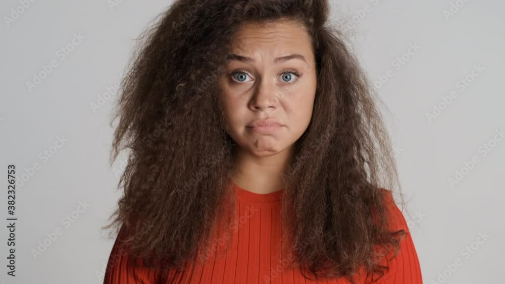 Emotional scared brunette girl stare with bugged eyes standing alarmed ...