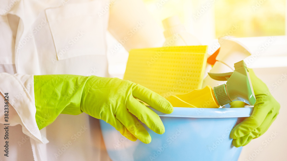 Cleaning lady or cleaner with cleaning products Stock Photo | Adobe Stock