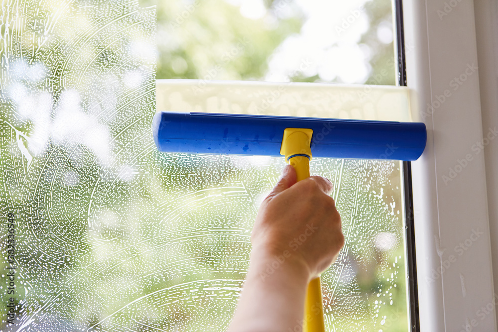 Hand of window cleaner when cleaning window Stock Photo | Adobe Stock